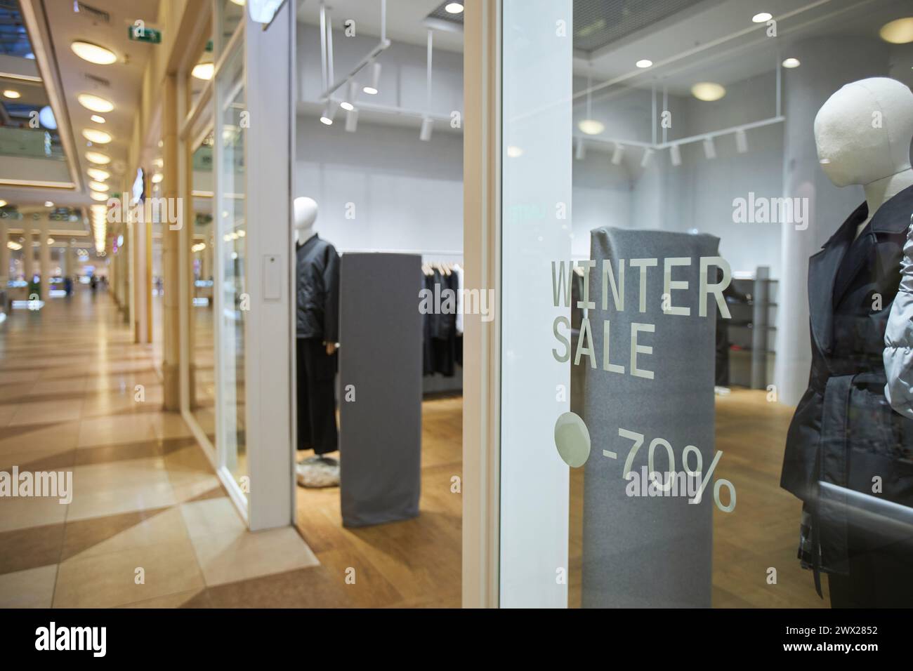 Background image of glass storefront displays in shopping mall at ...