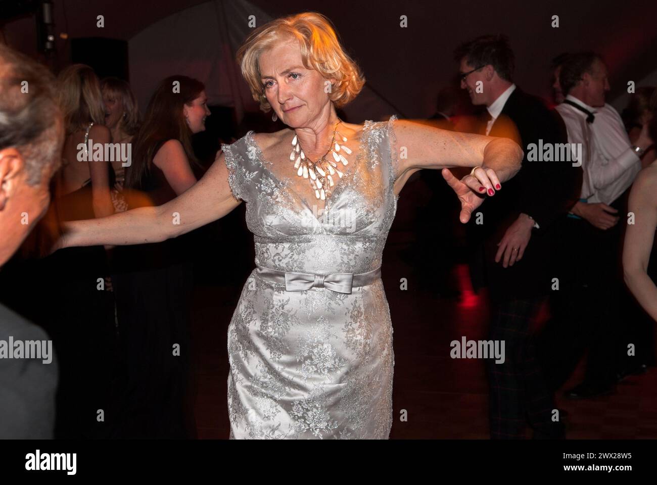 Older couple woman disco dancing, at a society dinner dance. Wealthy ...
