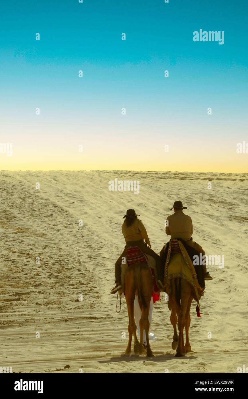 Tourists rides camels in inland sea desert, Caravan going through the ...