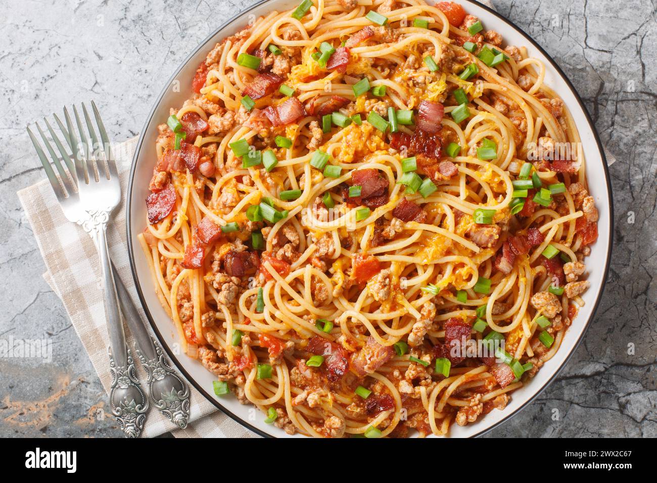 Cowboy spaghetti is made with fire-roasted tomatoes, ground beef, bacon ...