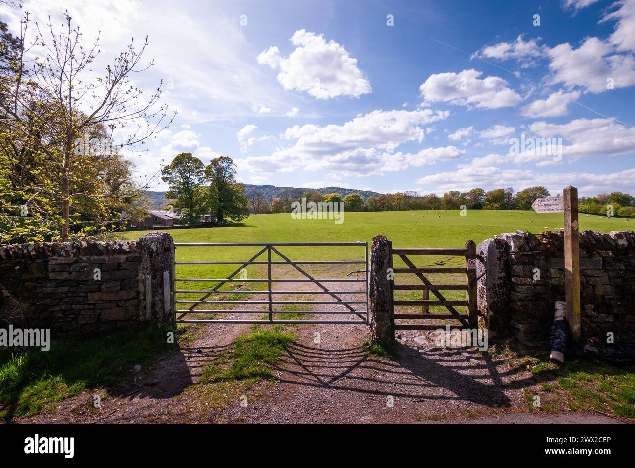 A metal barred gate and footpath sign Stock Photo - Alamy