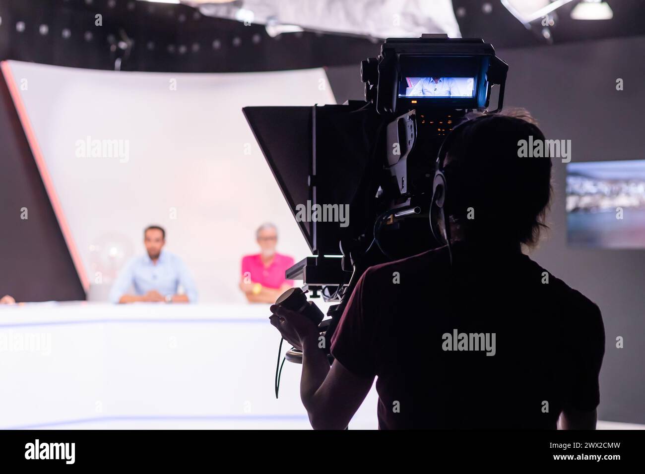 Cameraman silhouette. Professional cameraman - covering on event with a ...