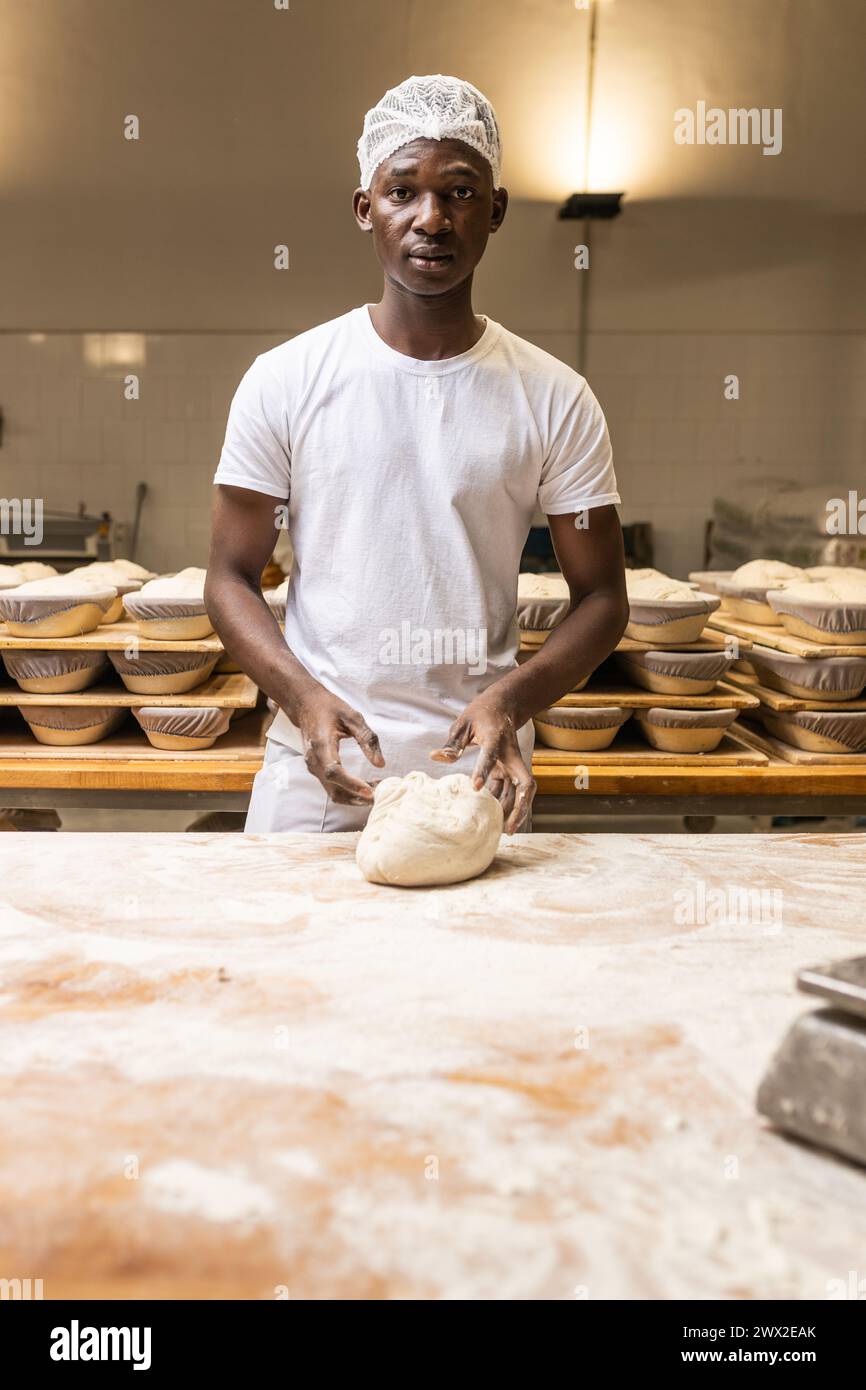 young black man working in a bread factory, learning the trade Stock ...
