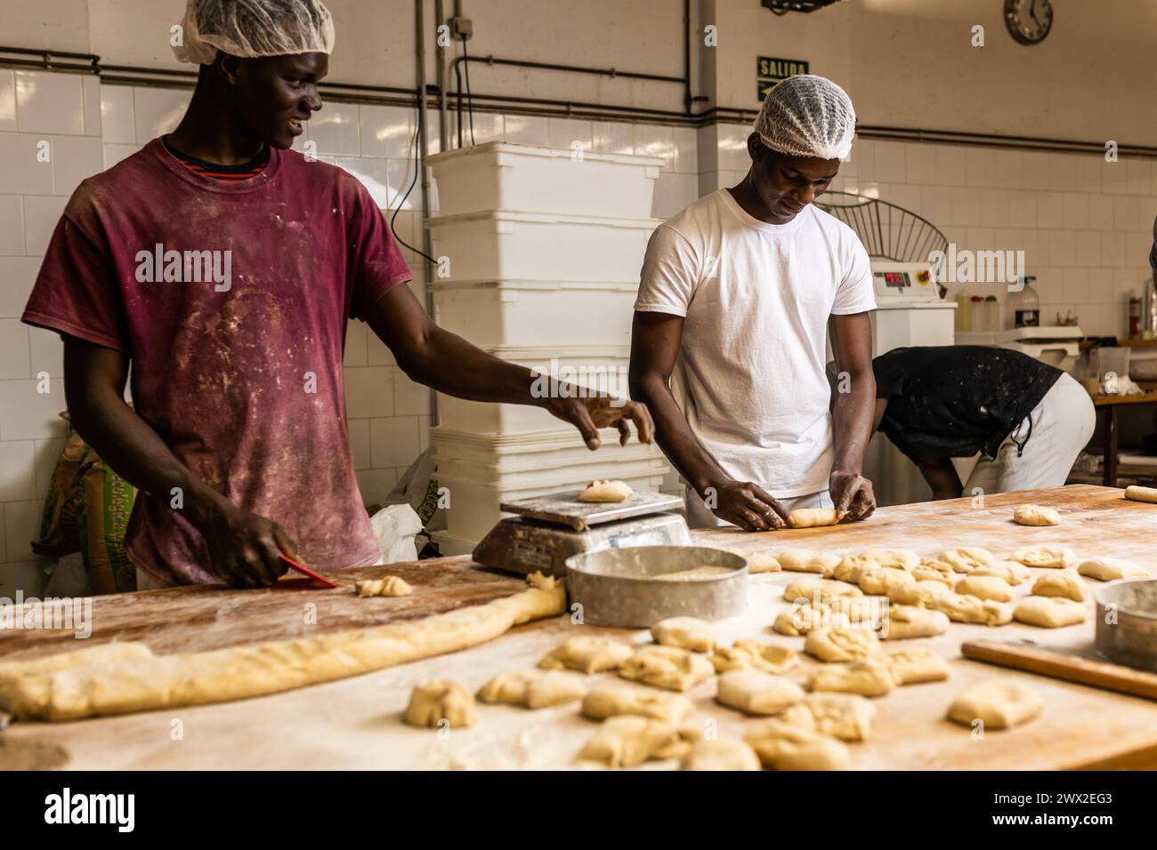 two men young black classmates learning how to make cakes from master ...