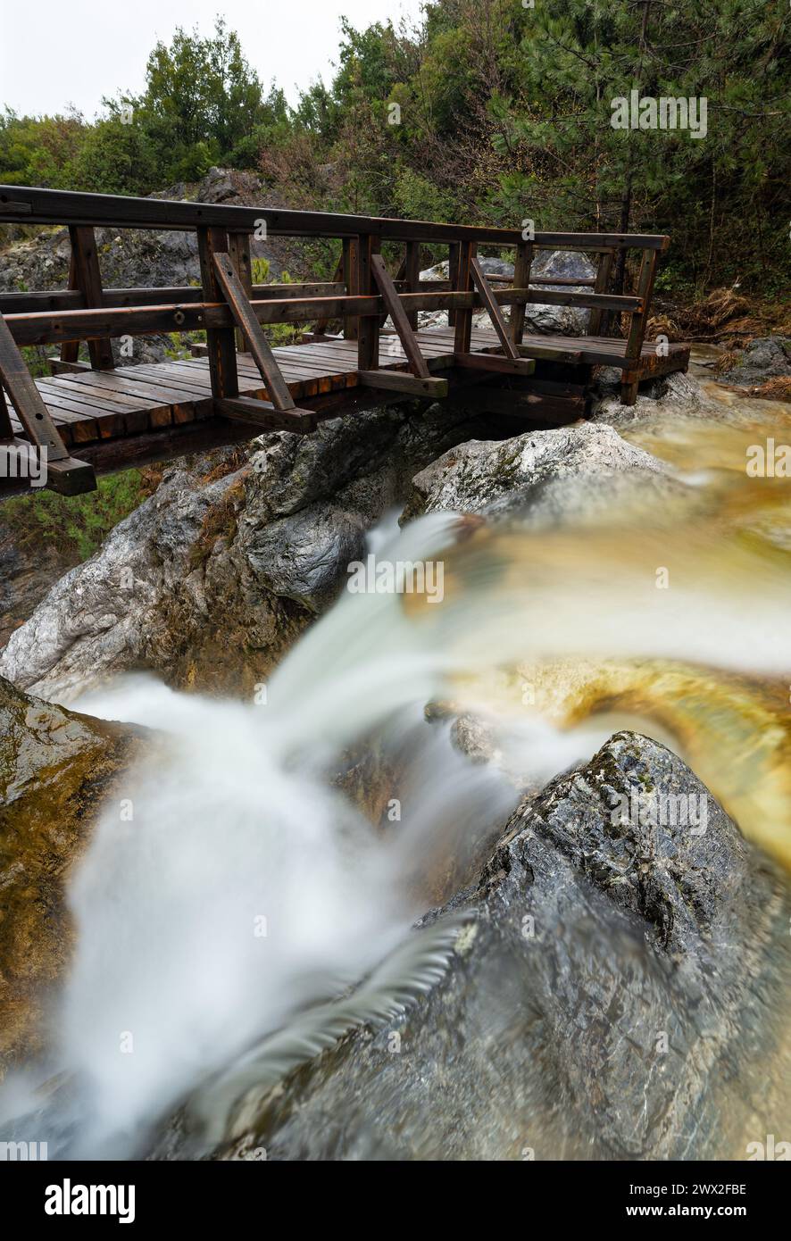 View of the waterfall of Aghia Kori with small wooden bridge at the ...