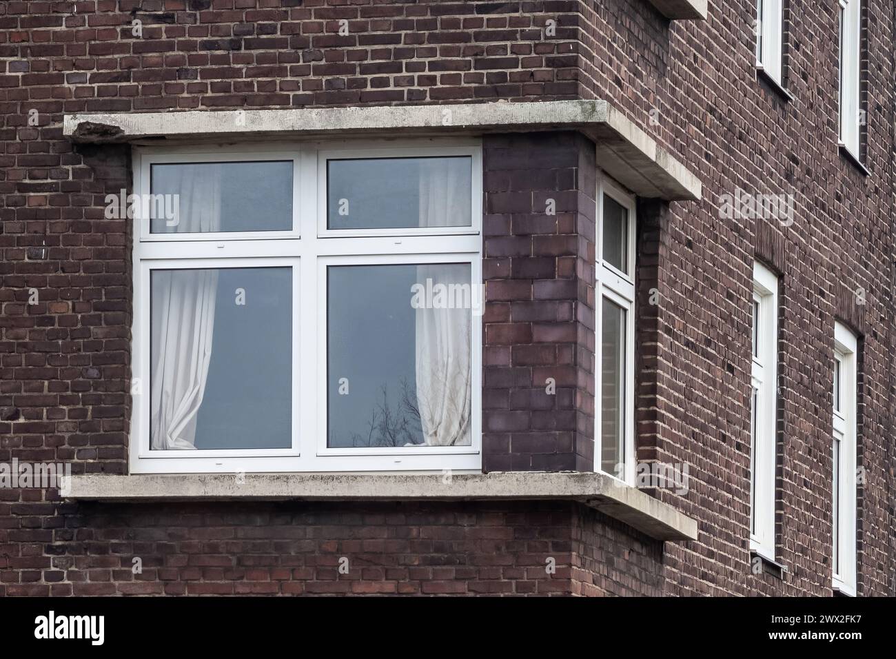 Corner window of a brick residential building Stock Photo - Alamy