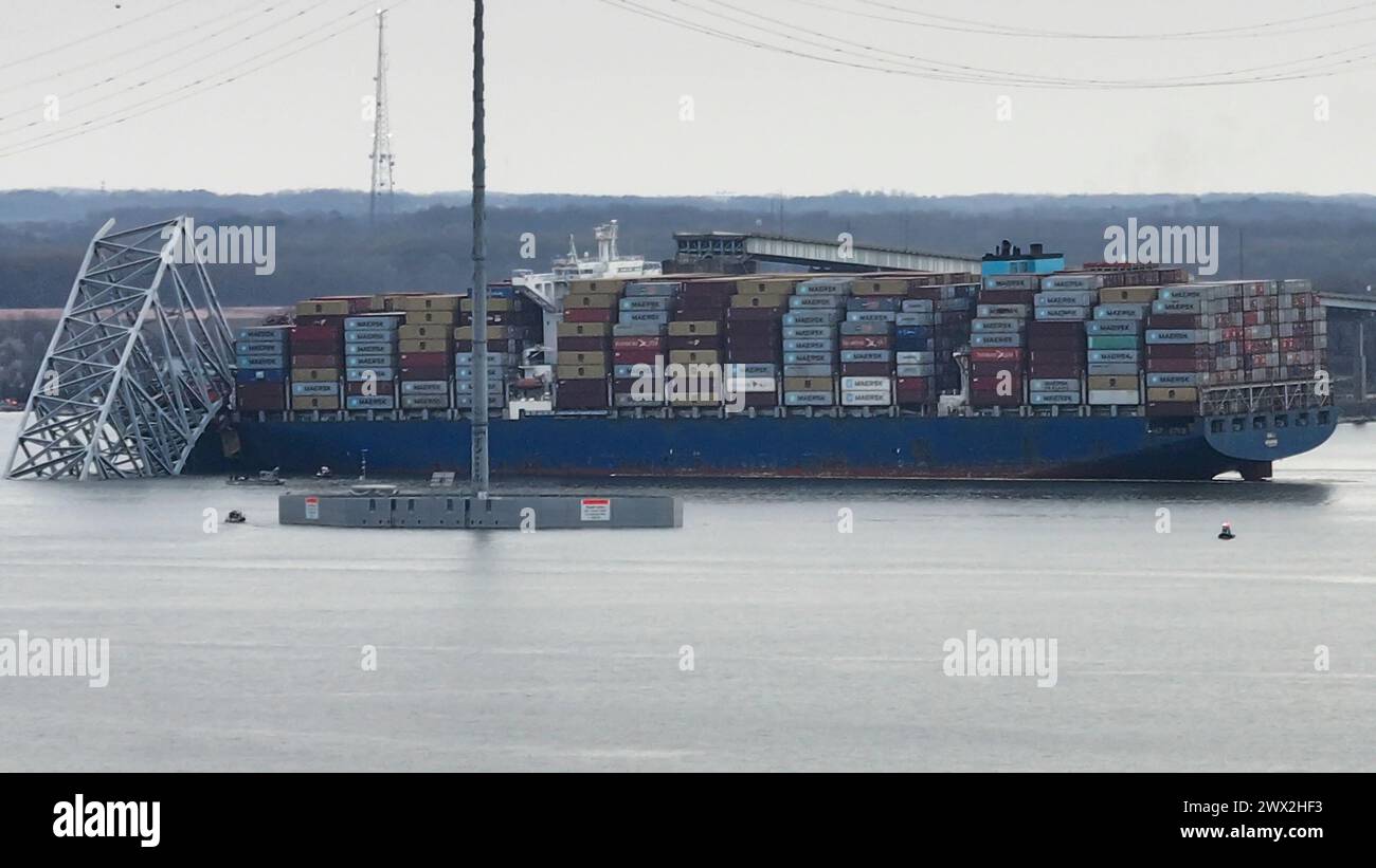 Steel debris from the fallen Francis Scott Key Bridge rests on the bow ...