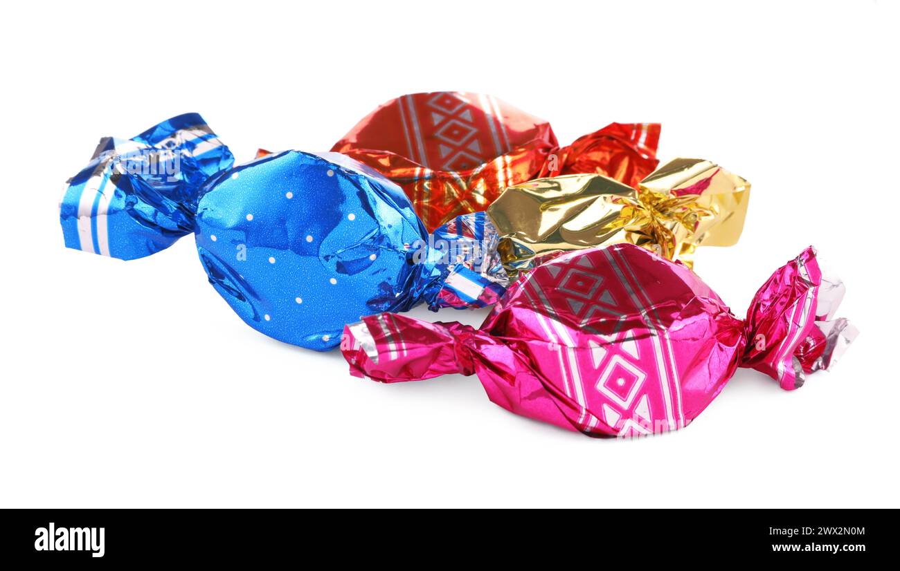 Candies in colorful wrappers isolated on white Stock Photo - Alamy