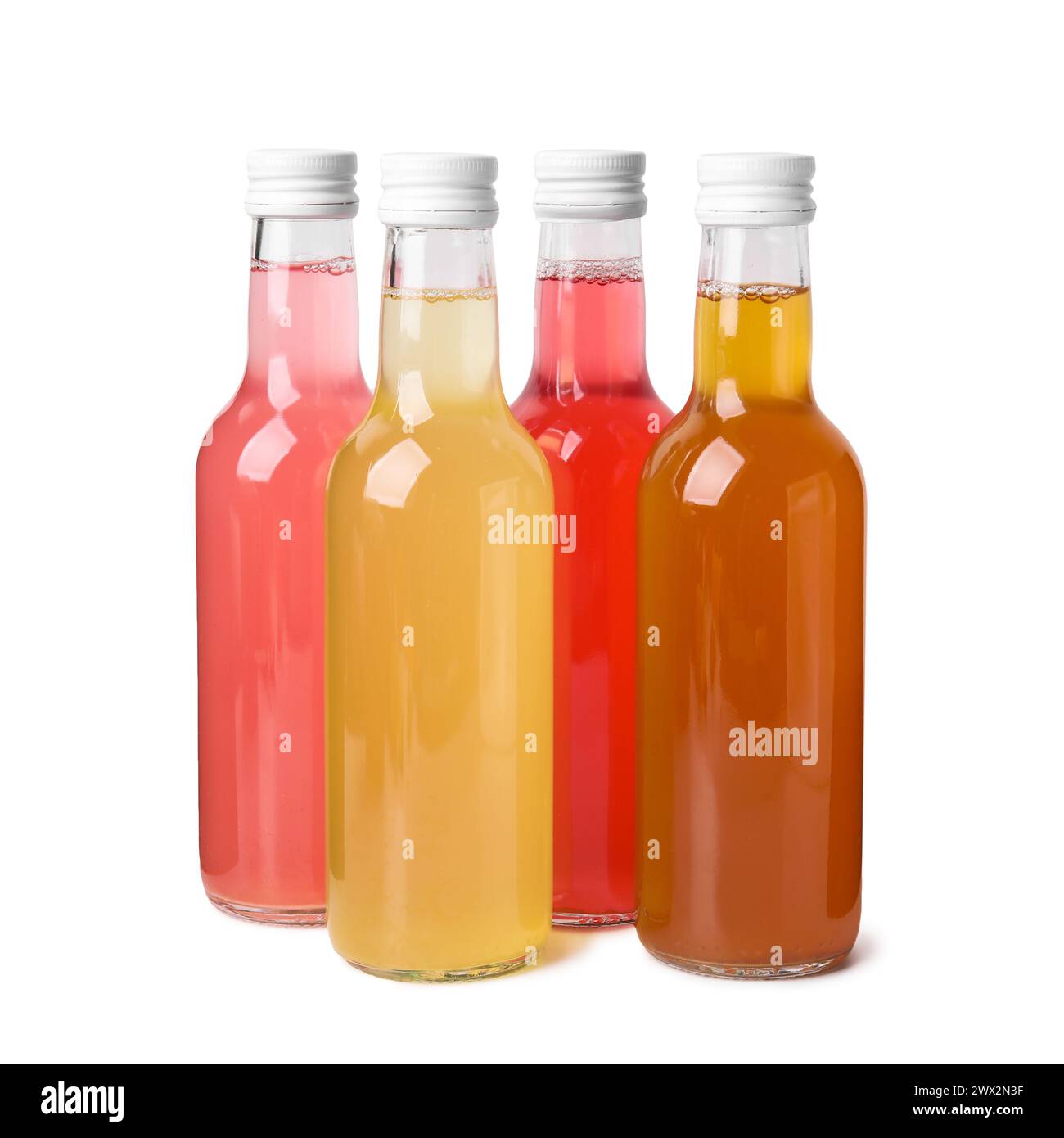 Delicious kombucha in glass bottles isolated on white Stock Photo - Alamy