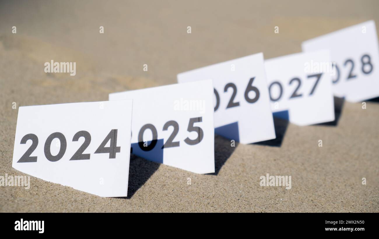Paper cards with numbers of years from 2024 to 2028 in a row. New year ...