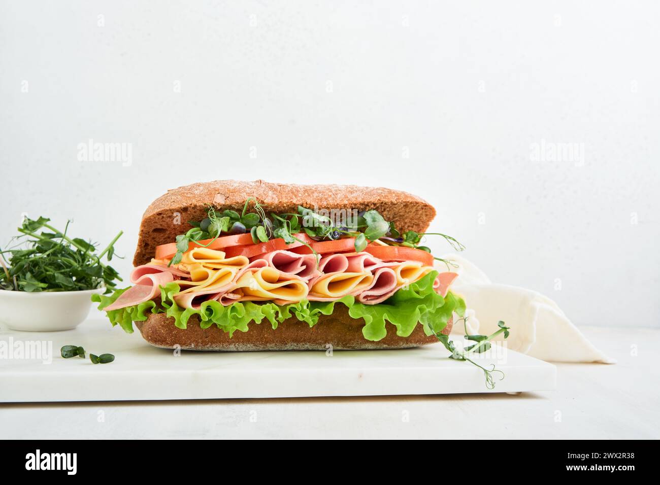 Sandwich. One fresh big submarine sandwich with ham, cheese, lettuce ...