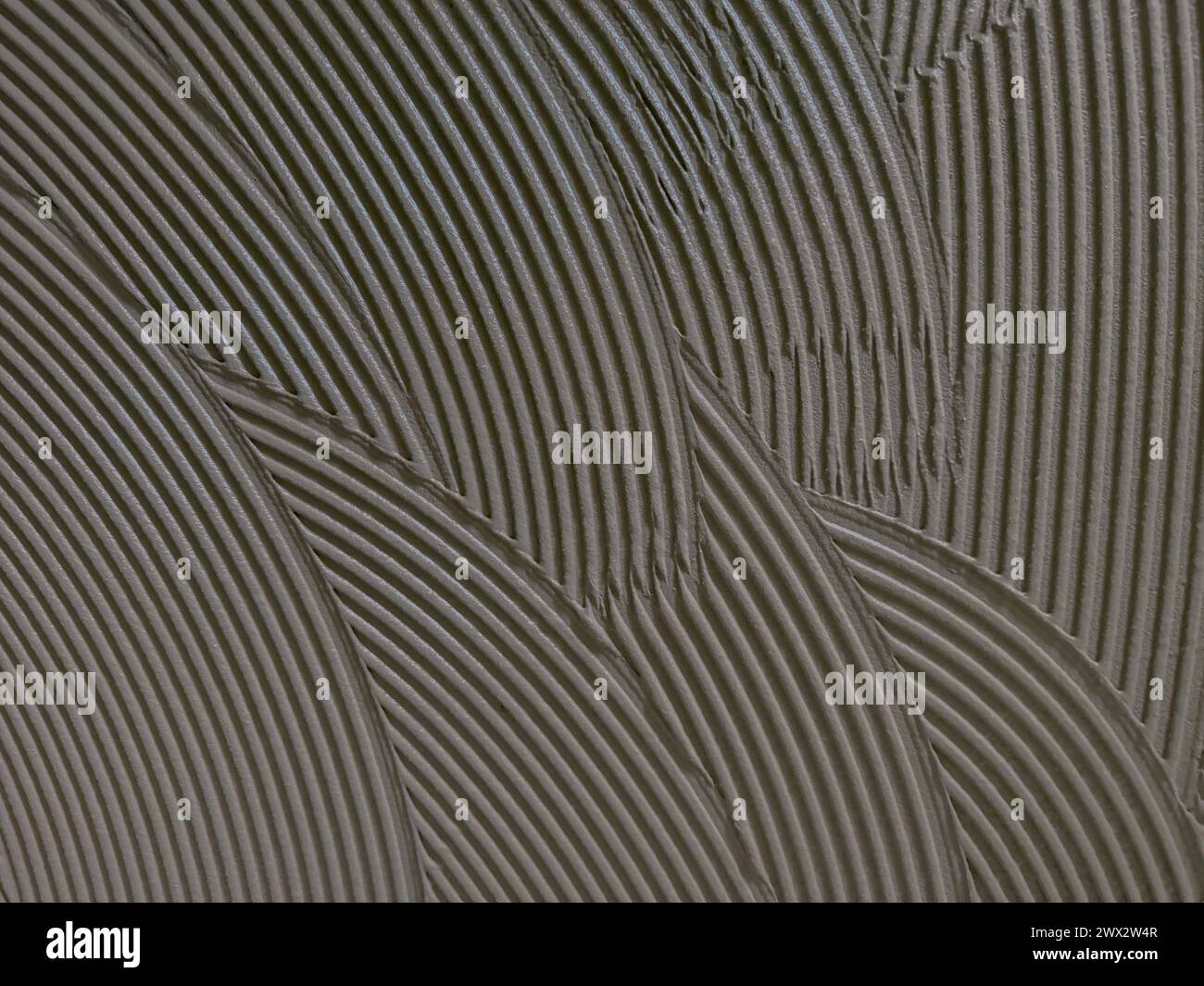 Texture cementitious adhesive applied to the floor ready to receive the ...