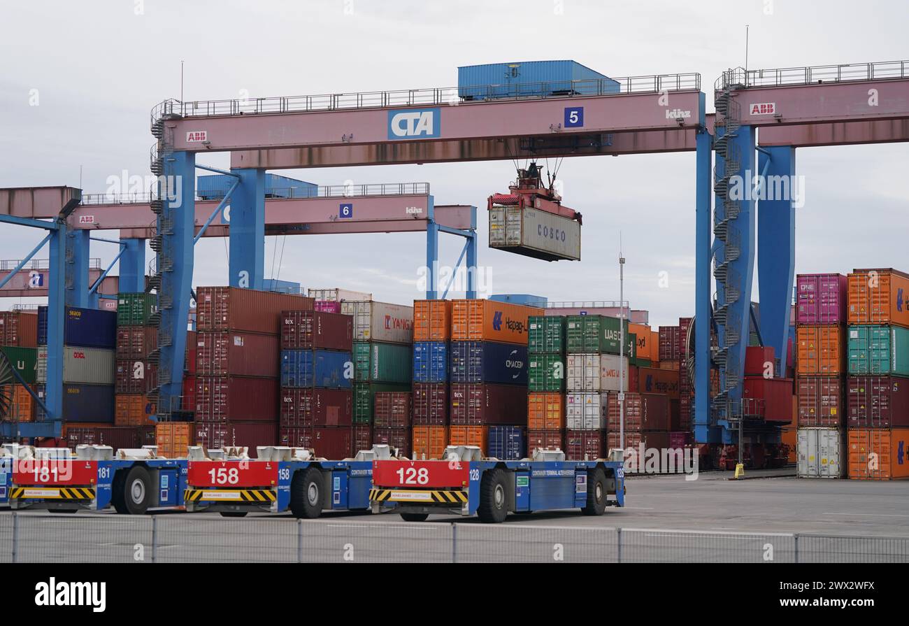 26 March 2024, Hamburg: Containers are handled at the Container ...