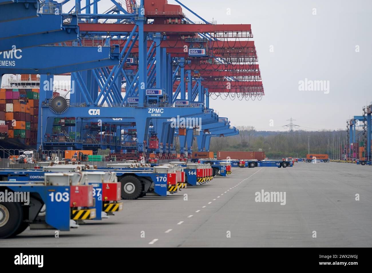 26 March 2024, Hamburg: Containers are handled at the Container ...