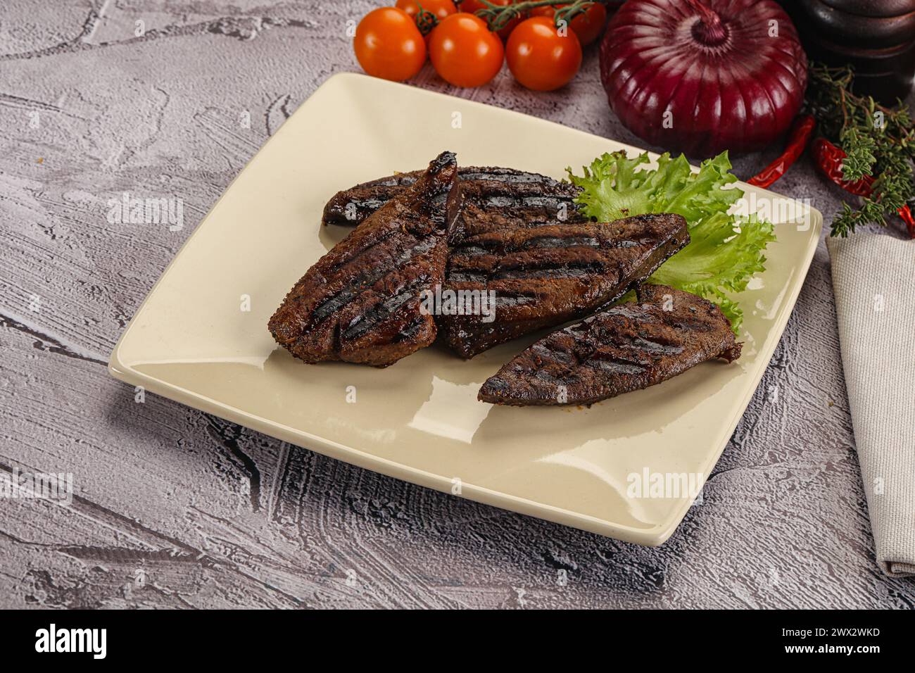 Grilled diet beef liver steak in the plate Stock Photo - Alamy