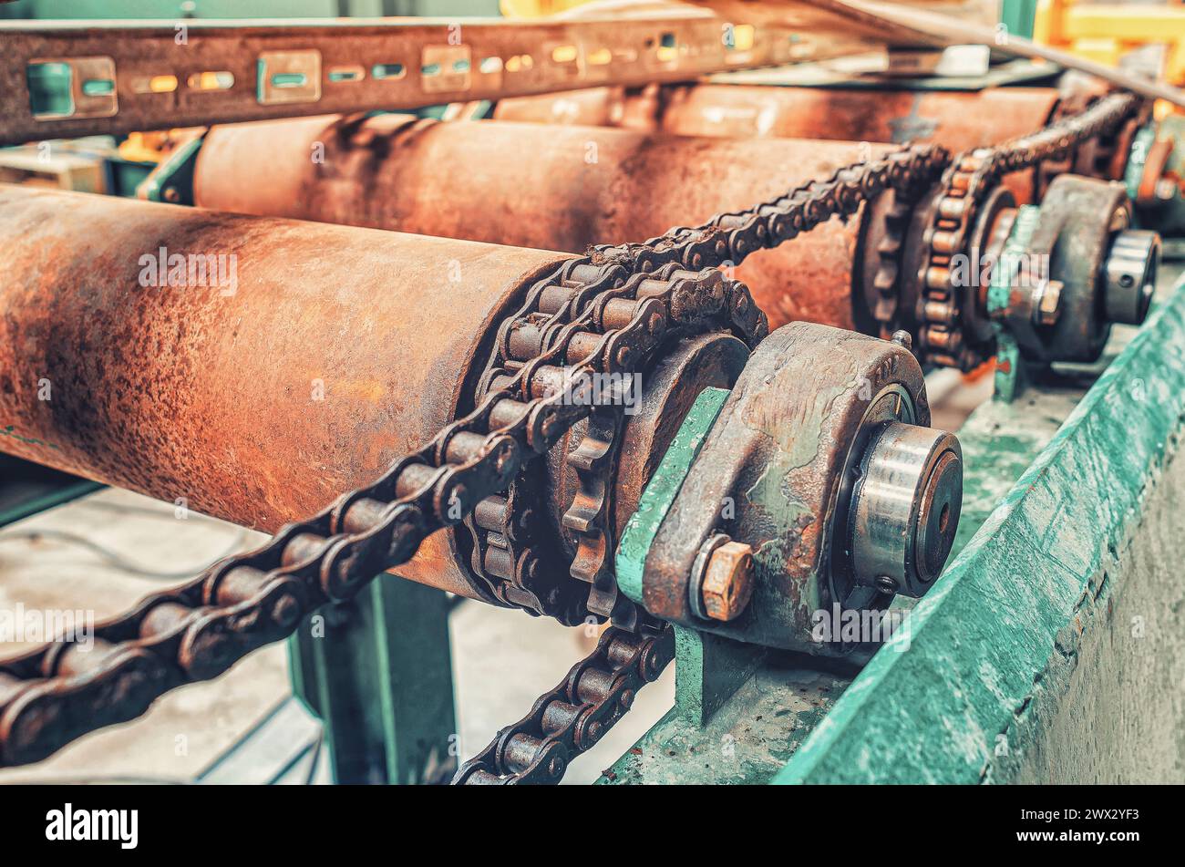Corroded parts of old broken transmission close-up. Rusty metal chain ...