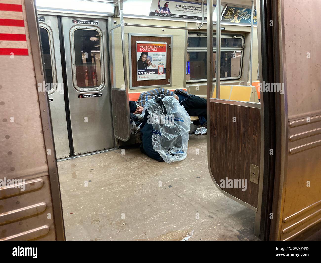 Homeless man sleeping on a subway train in New York on Saturday, March ...