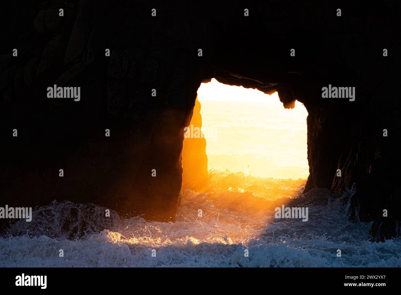 Sunset illuminates the Window in the Rock feature of Keyhole Arch at ...