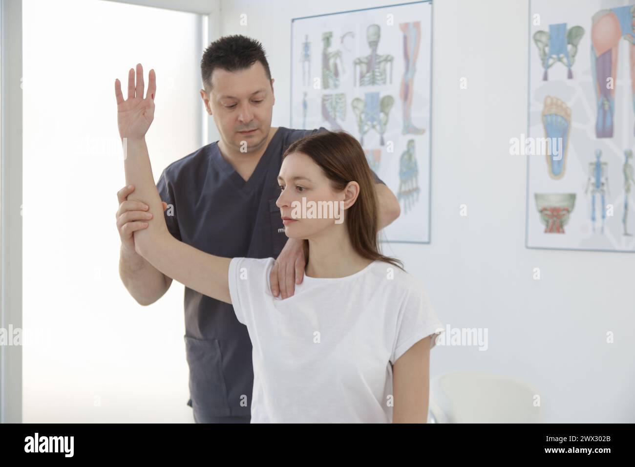 Woman at the doctors office on chiropractic, physiotherapy or ...