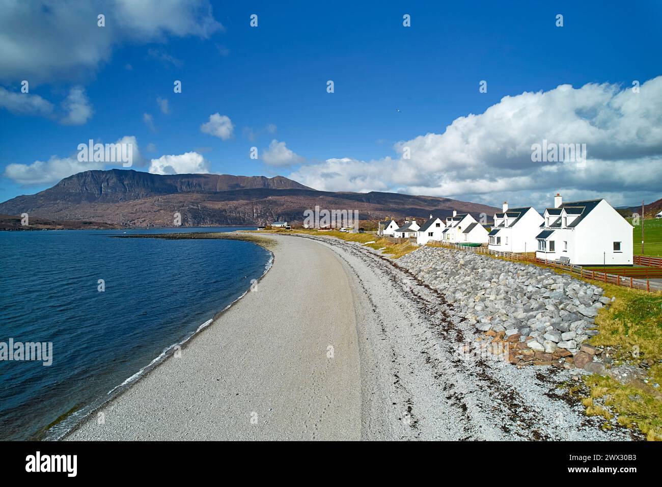 Ardmair Wester Ross Scotland blue sky the grey pebble beach and Ben Mor ...
