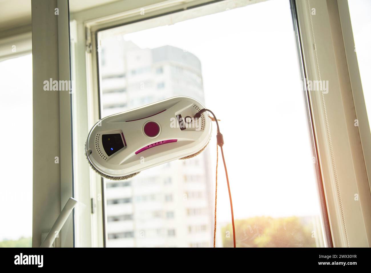 Modern device for cleaning glass from dirt and streaks. Robot washer ...