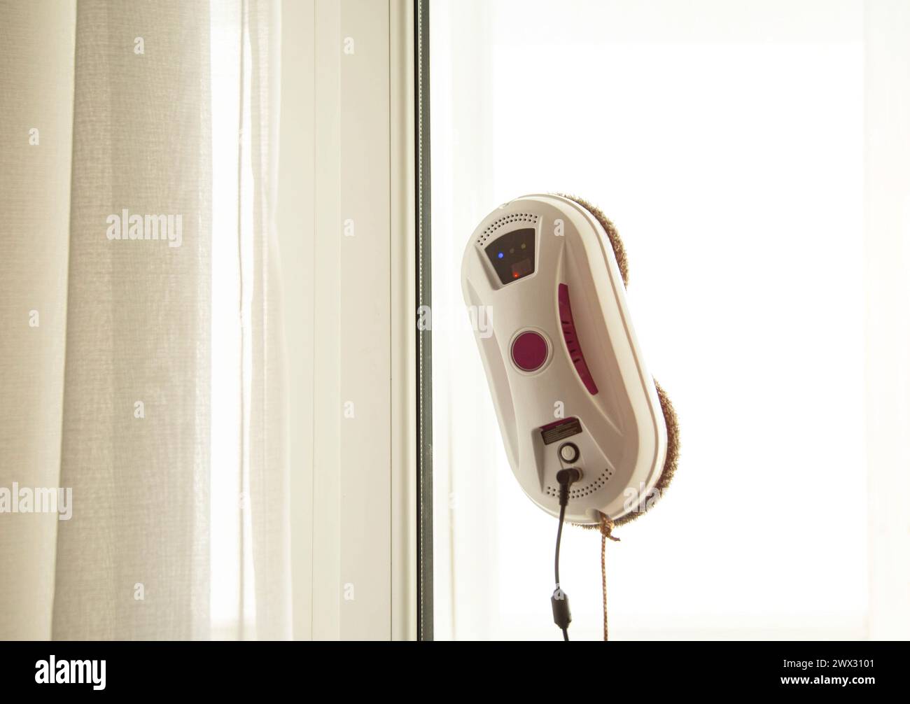 Modern device for cleaning glass from dirt and streaks. Robot washer ...