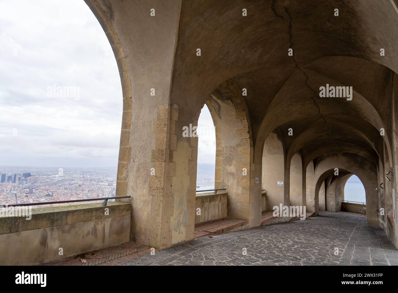 view of the cluster of buildings in Naples through the top of Castel ...