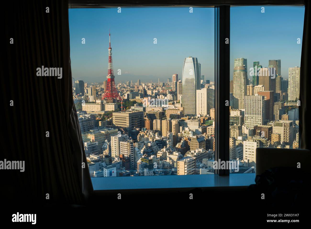 A hotel room with a view of Tokyo and Mount Fuji in the distance Stock ...