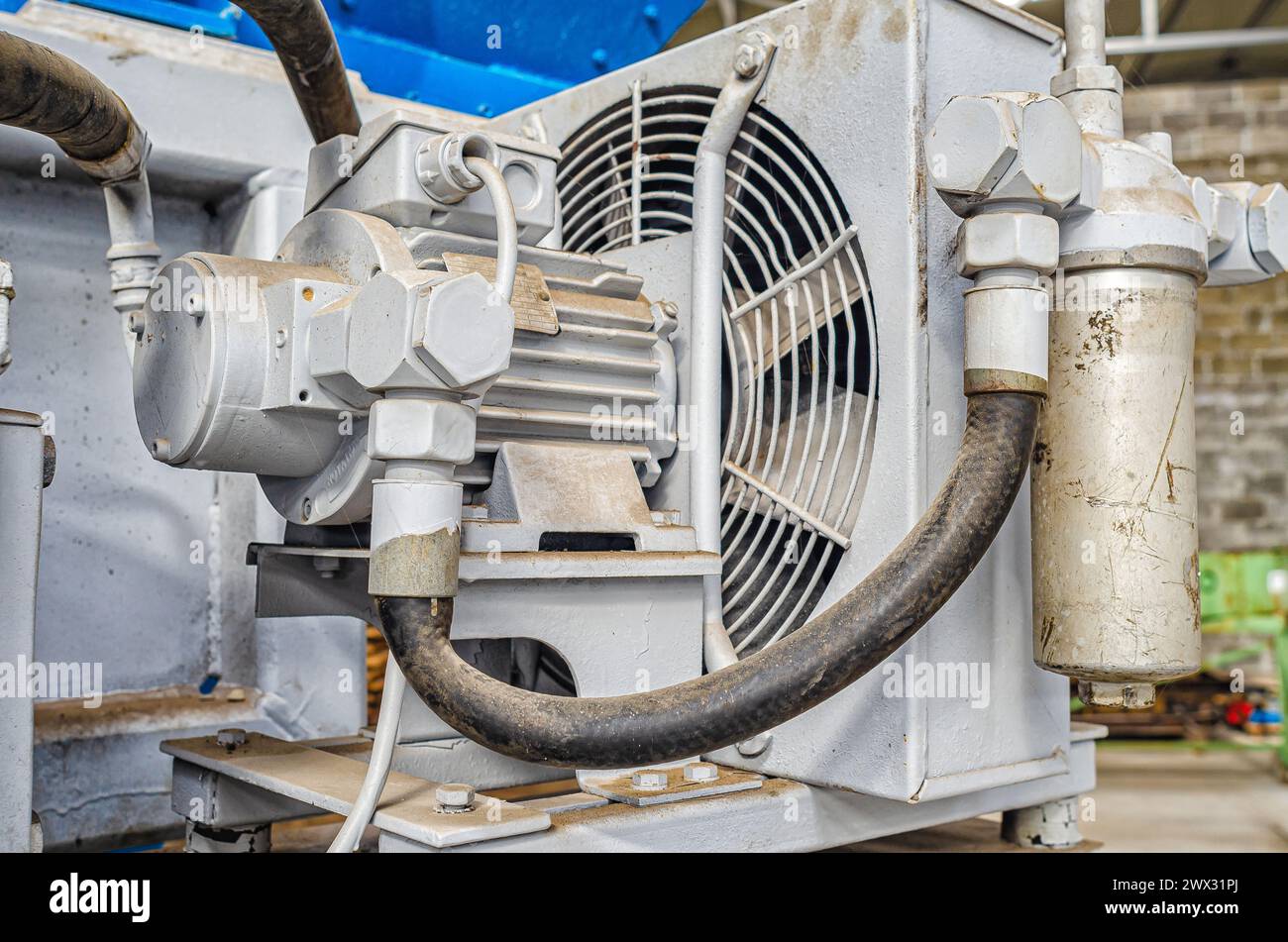 Rear view of an industrial fan in paving factory. Industrial background ...