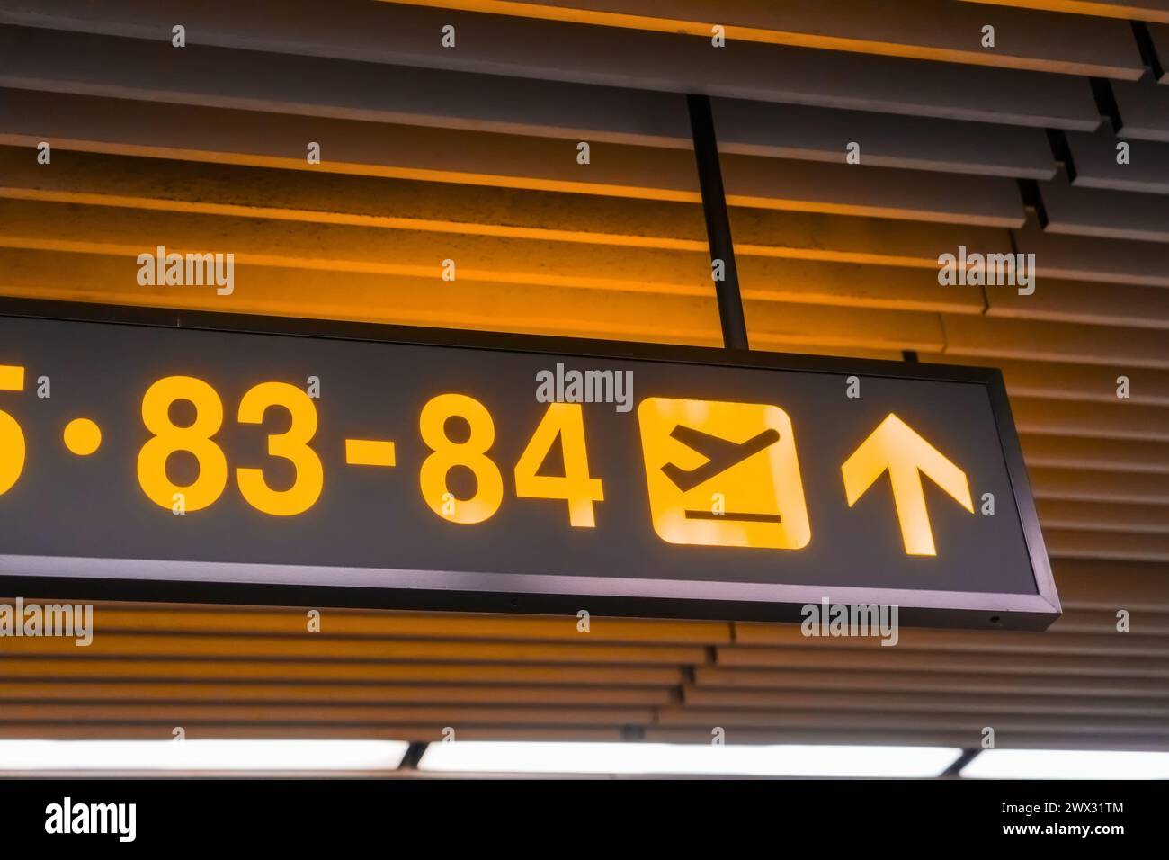 Signs to gate number 83-84 for boarding gates inside the airport ...