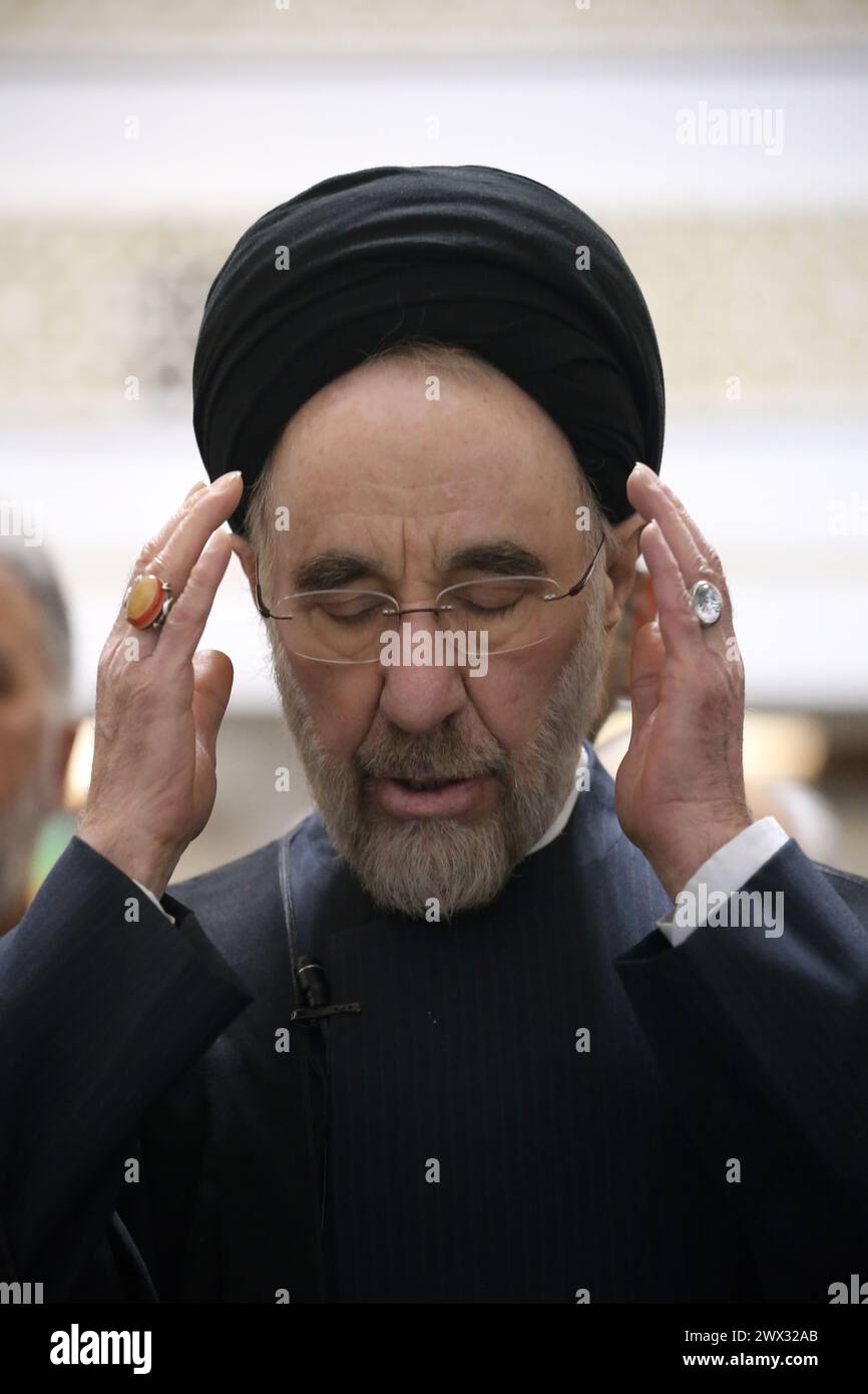 Tehran, Iran. 27th Mar, 2024. Former Iranian President MOHAMMAD KHATAMI says prayers during a ...