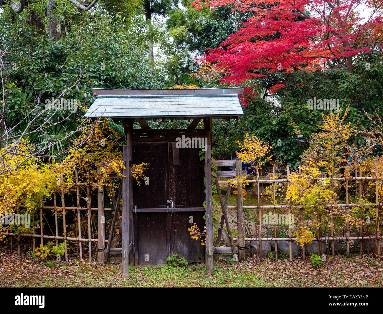 Wooden fence and wooden door in Insuien Garden in Nara, Japan. This ...