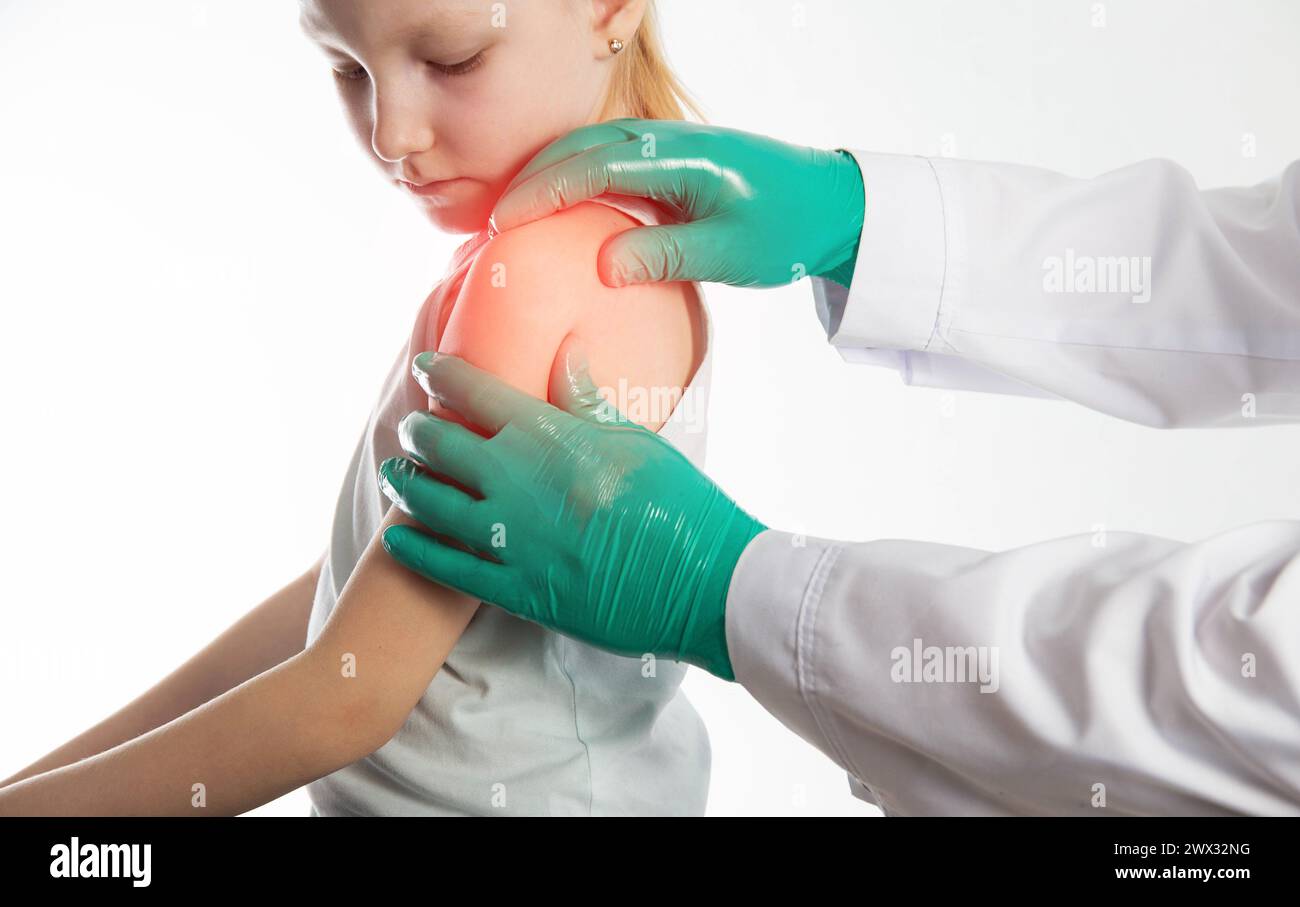 The hands of an orthopedic traumatologist doctor in green gloves ...
