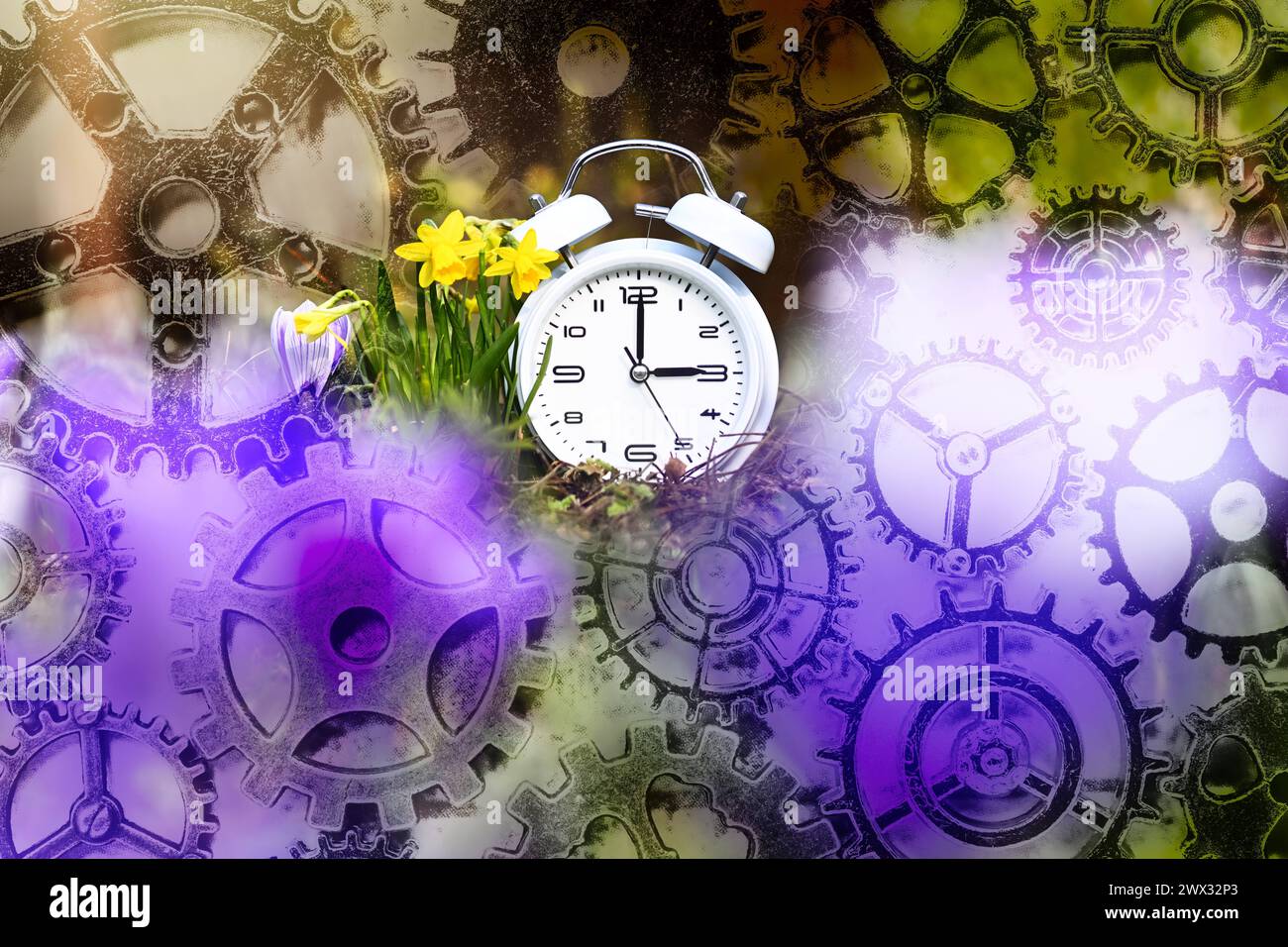 FOTOMONTAGE, Weißer Wecker inmitten von Frühlingsblumen mit Zahnrädern ...