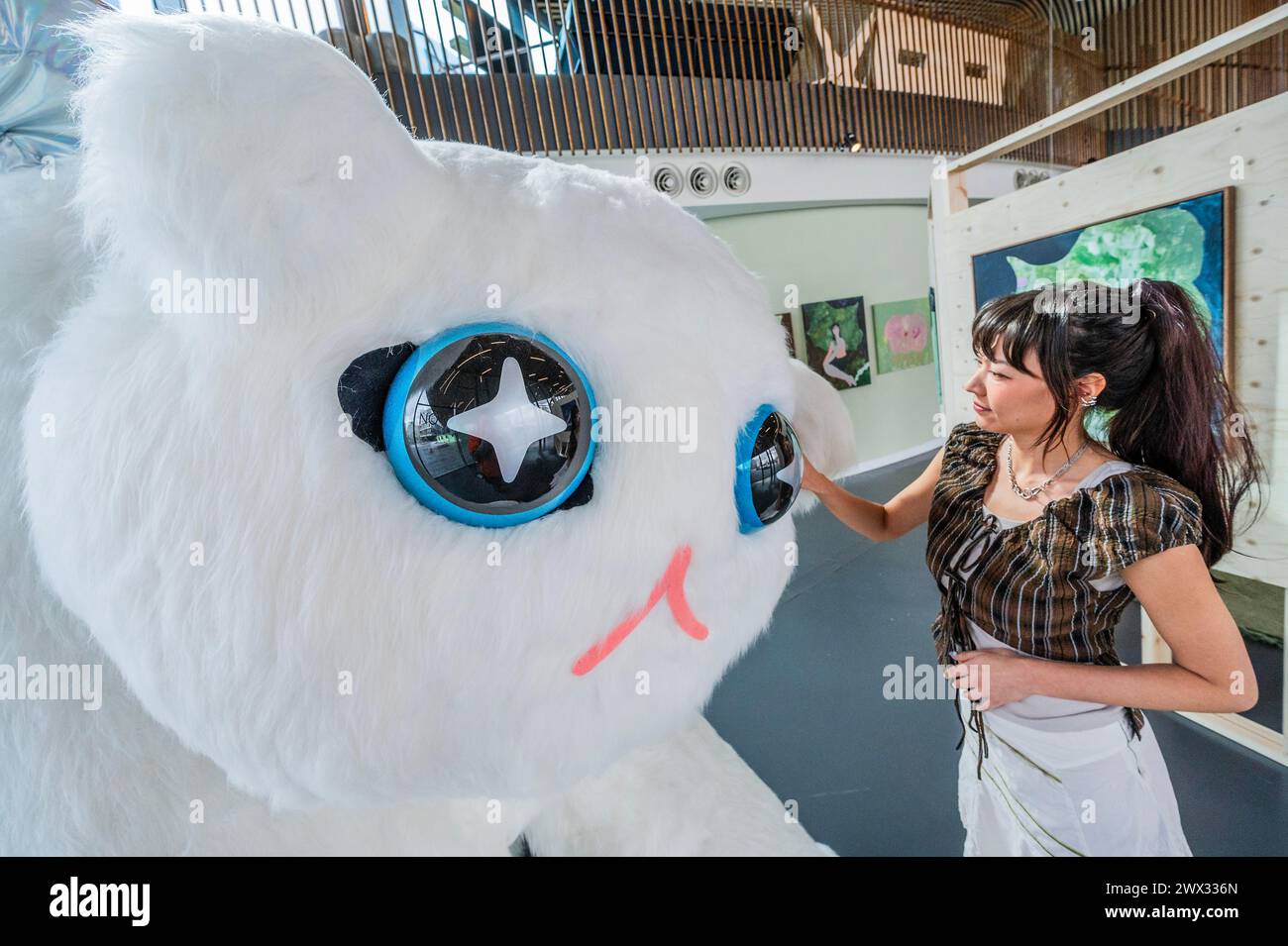 London, UK. 27 Mar 2024. Charlotte Mei with Melody (a giant winged ...