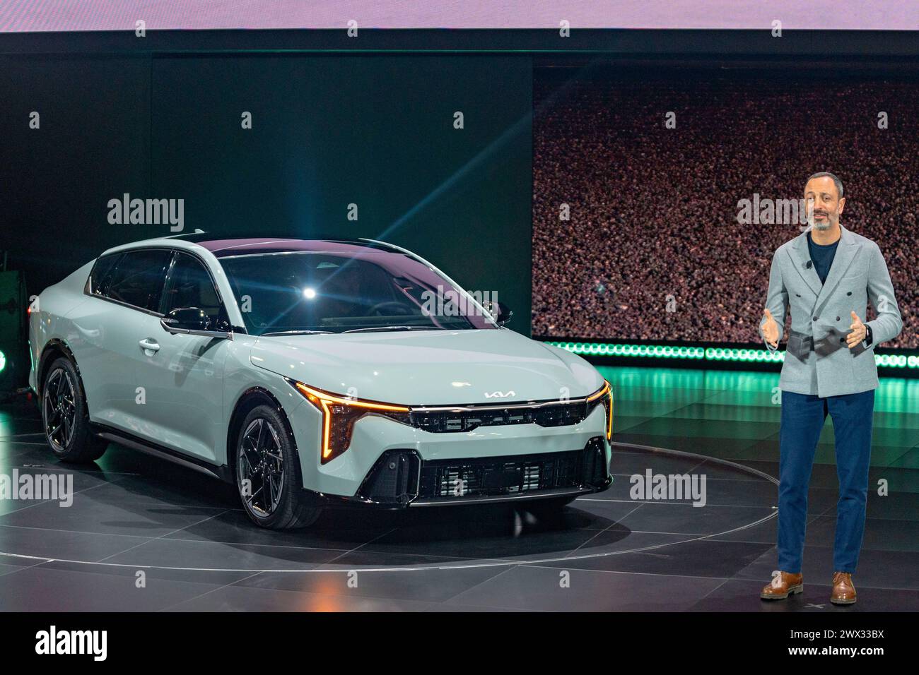 Karim Habib, KIA head of global design, stands with KIA's new K4 model ...