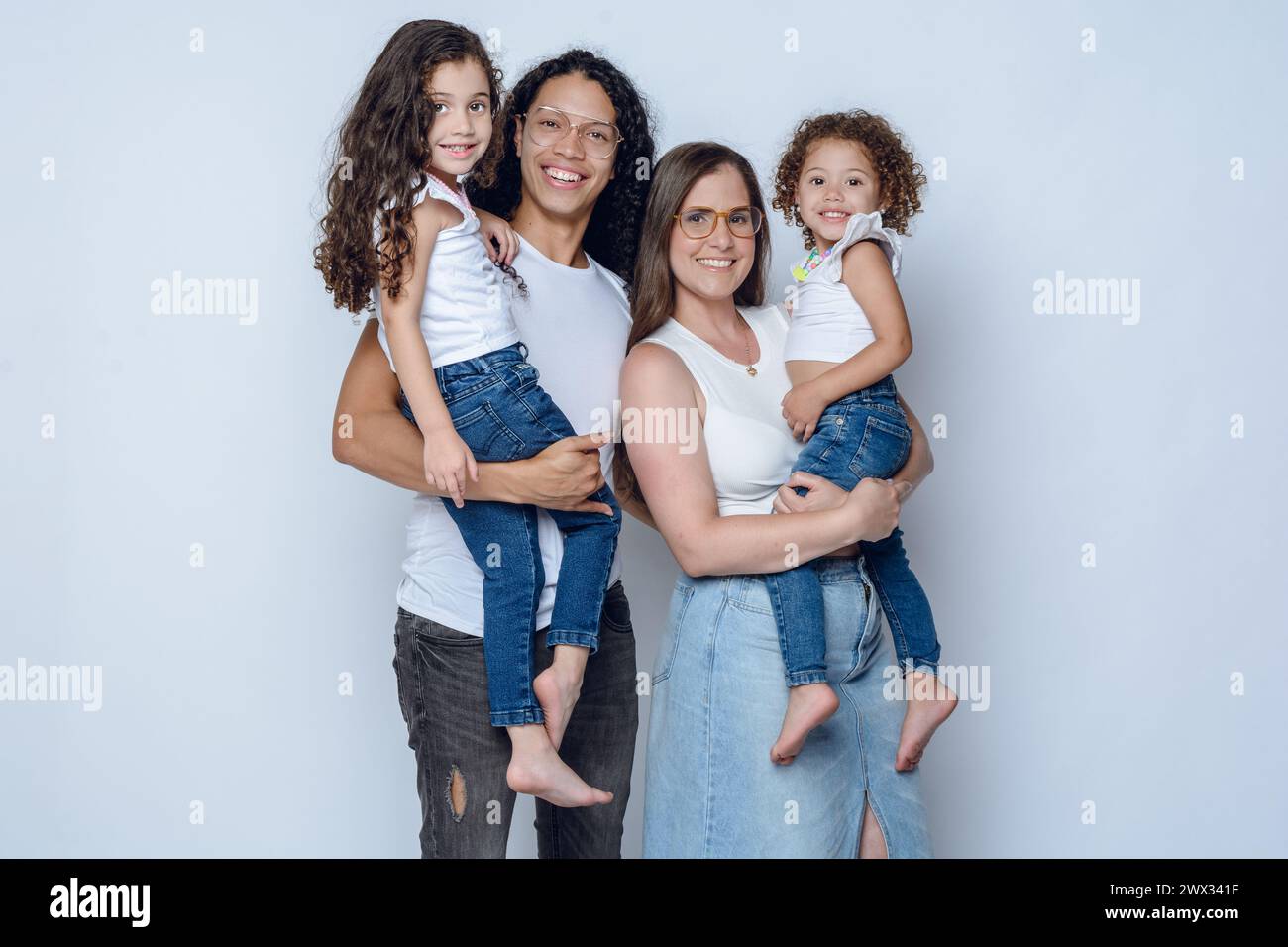 Mother father two daughters studio hi-res stock photography and images ...