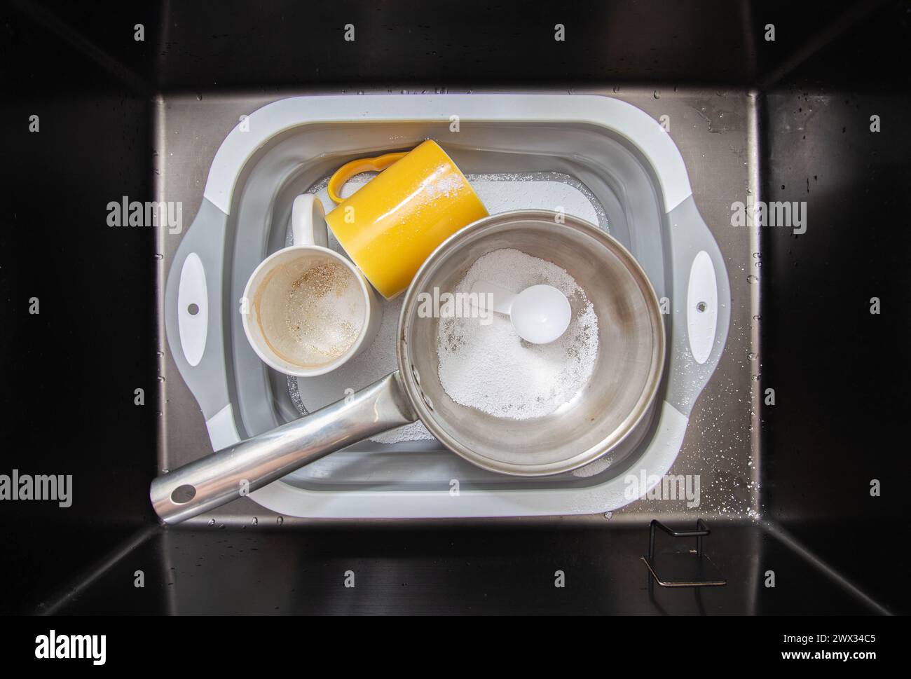 measuring spoon with granules of environmentally friendly oxygen bleach ...