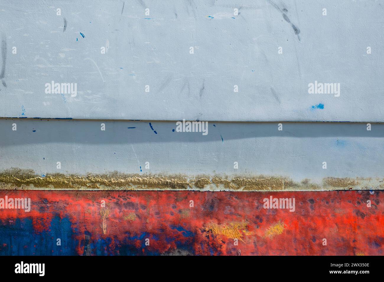 A close up closeup view of the paint on the side of the hull of a ...