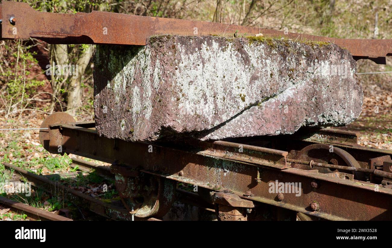 Heavy sandstone on a rusty vehicle for transportation in an inoperative ...
