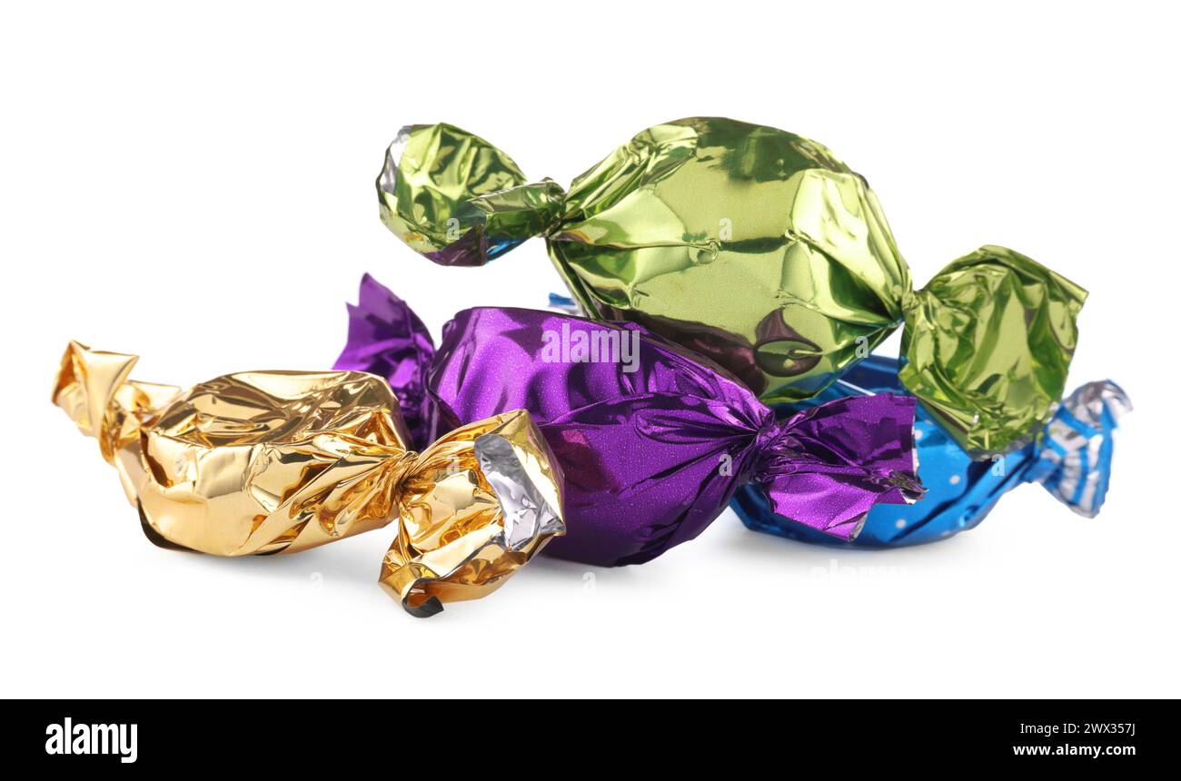 Candies in colorful wrappers isolated on white Stock Photo - Alamy