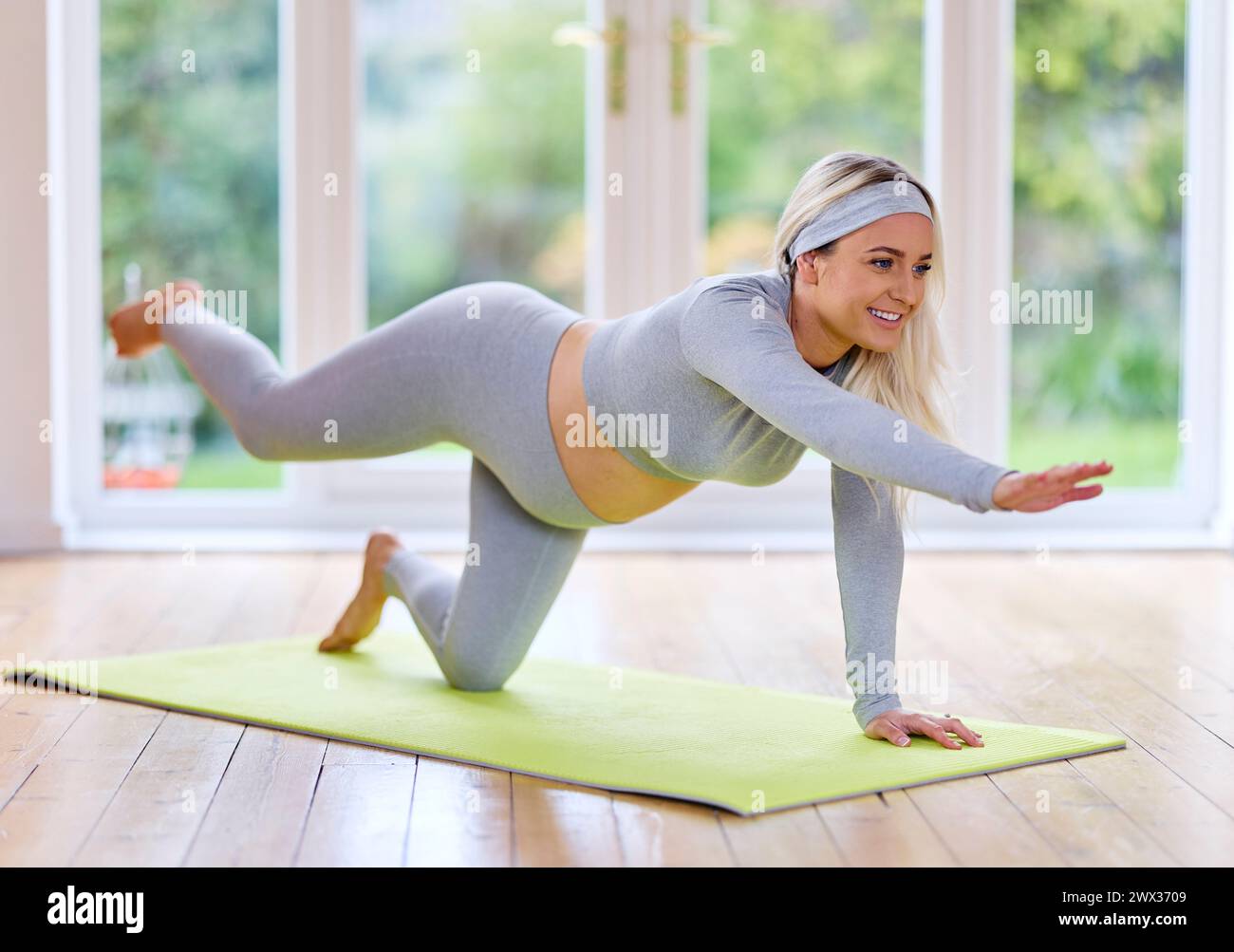 Woman doing pregnant yoga home hi-res stock photography and images - Alamy