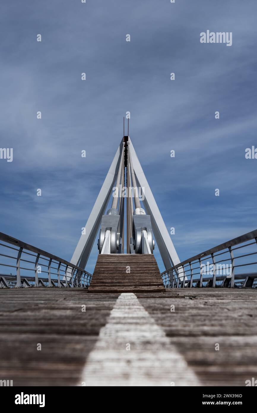 Bridge with wooden pedestrian walkway floor with paint marks and metal ...