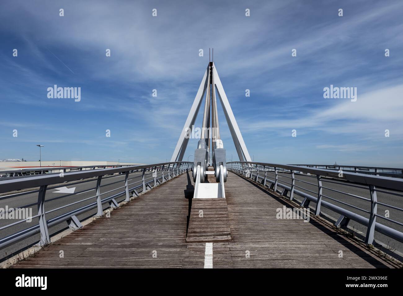 Bridge with wooden pedestrian walkway floor with paint marks and metal ...
