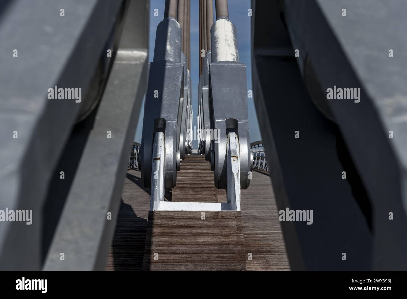 metal braces to support the structure of a bridge with pedestrian ...