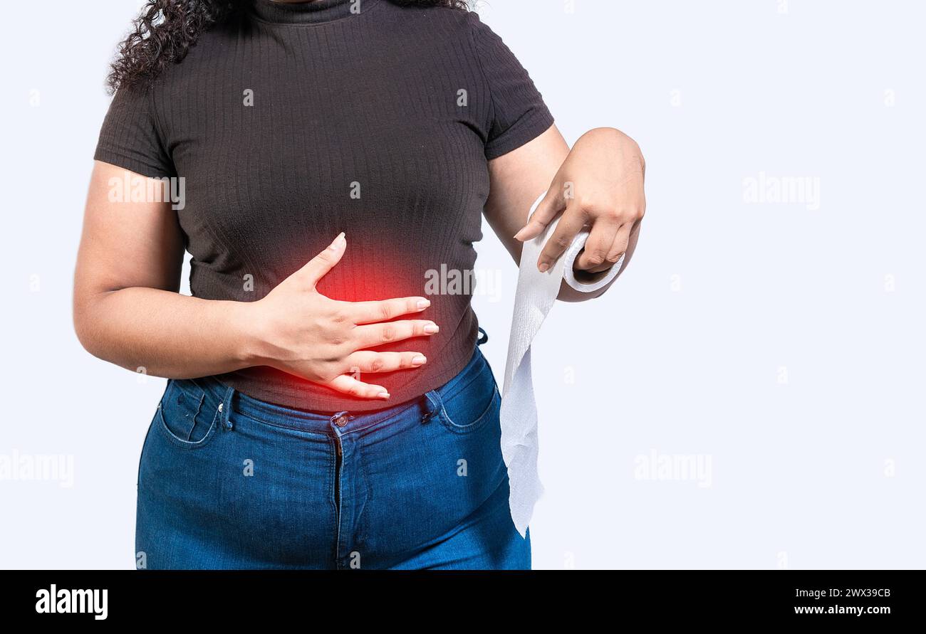 Woman with stomach problems holding roll of paper. Person with stomach ...