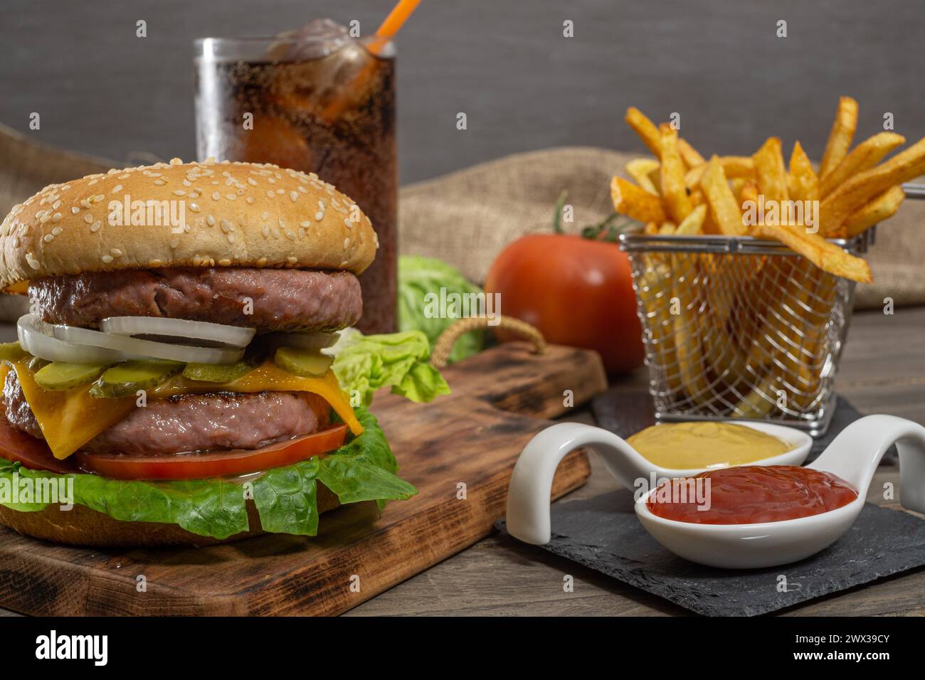 Complete burger with lettuce, cucumber, tomato, onion and cheddar ...