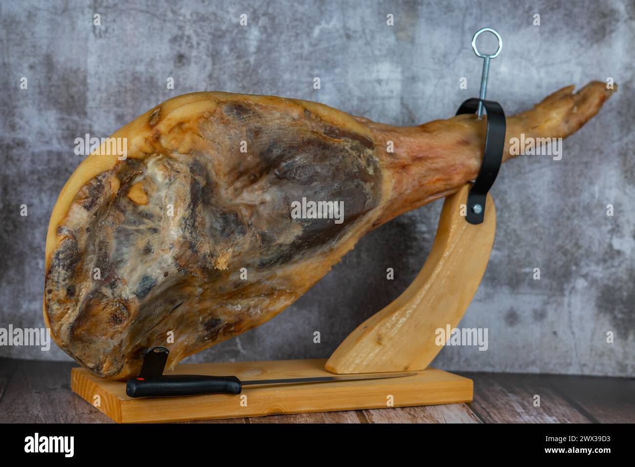 Spanish acorn-fed iberian ham close-up open knife cut Stock Photo - Alamy