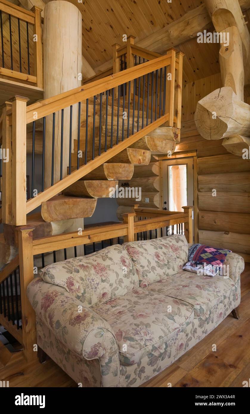 High angle view of twisting staircase with wooden and black wrought ...