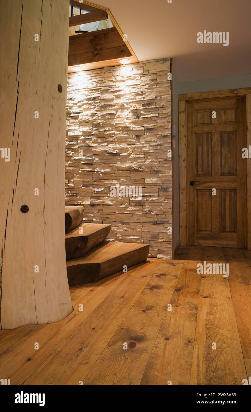 Door and twisting wooden staircase with brown stained half log steps ...
